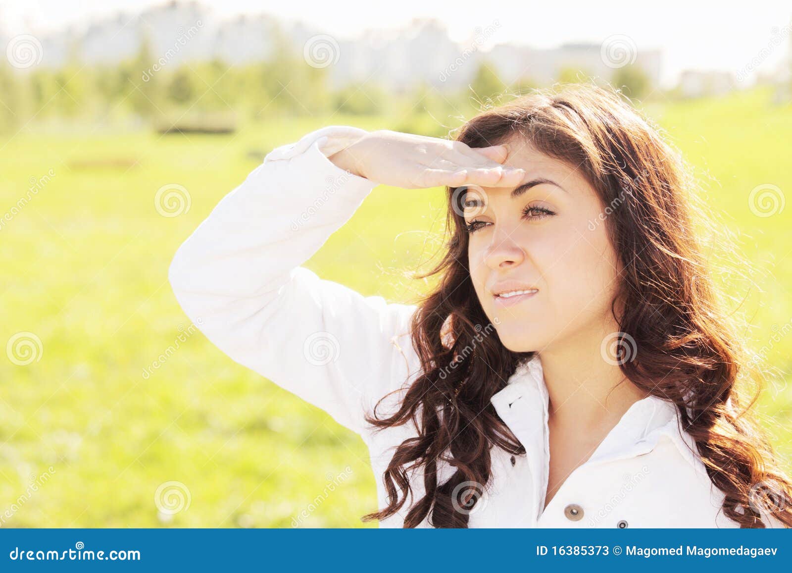 Young Woman Looking from Under Hand Peak Stock Image - Image of brown ...