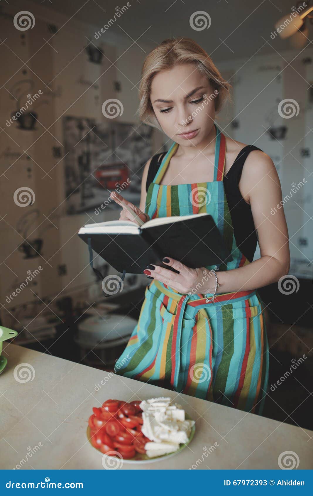 Young Woman Looking Up in a Recipes Book Stock Image - Image of ...