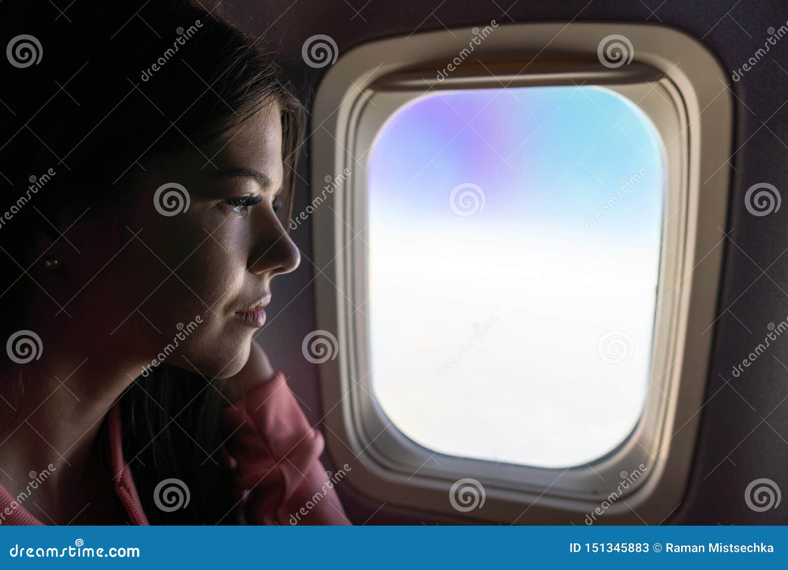 Young Woman Looking through Window in Airplane Stock Image - Image of ...