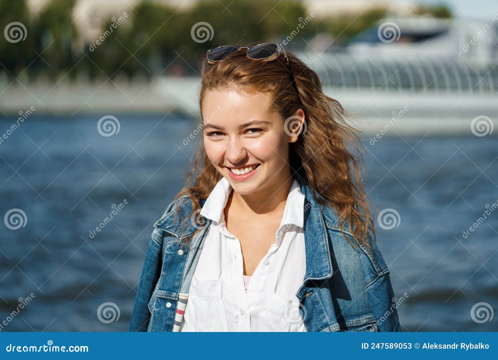 A Young Woman Looks into the Camera and Smiles. Stock Image - Image of ...