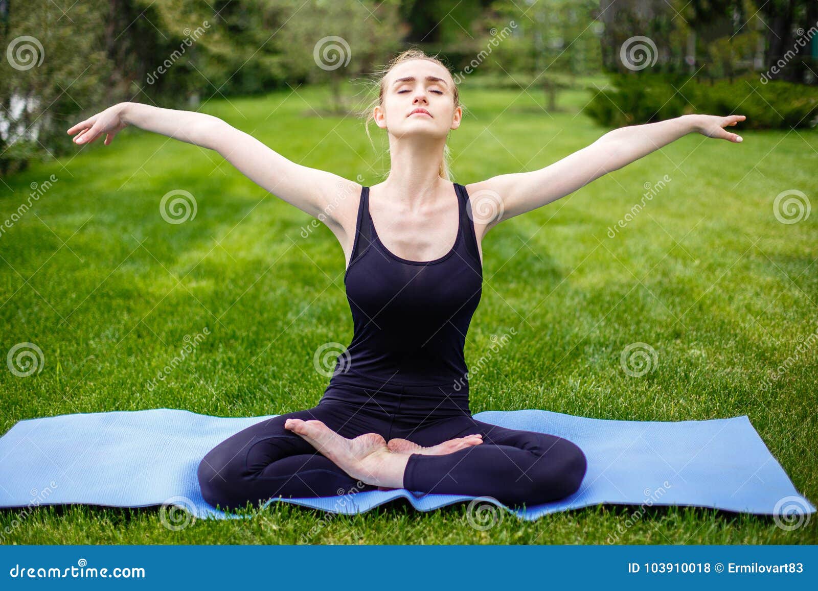 Young Woman in Lotus Pose in the Park. Stock Photo - Image of park ...