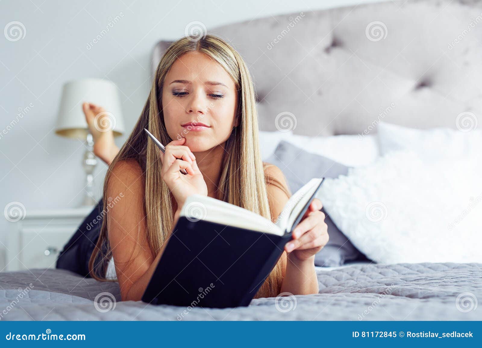 Young Woman Lying in Bed with Diary Stock Image - Image of girl ...