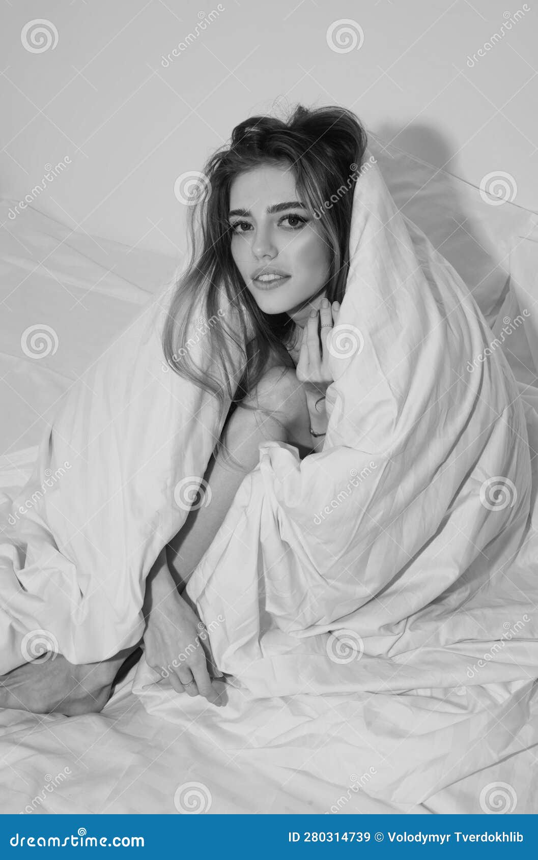 Young Woman Lying in Bed and Hiding Under the Sheet. Stock Image ...