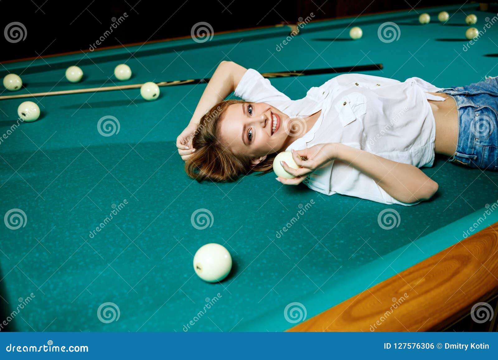Young Woman Lying on the Billiard Table and Looking at Camera. Stock ...