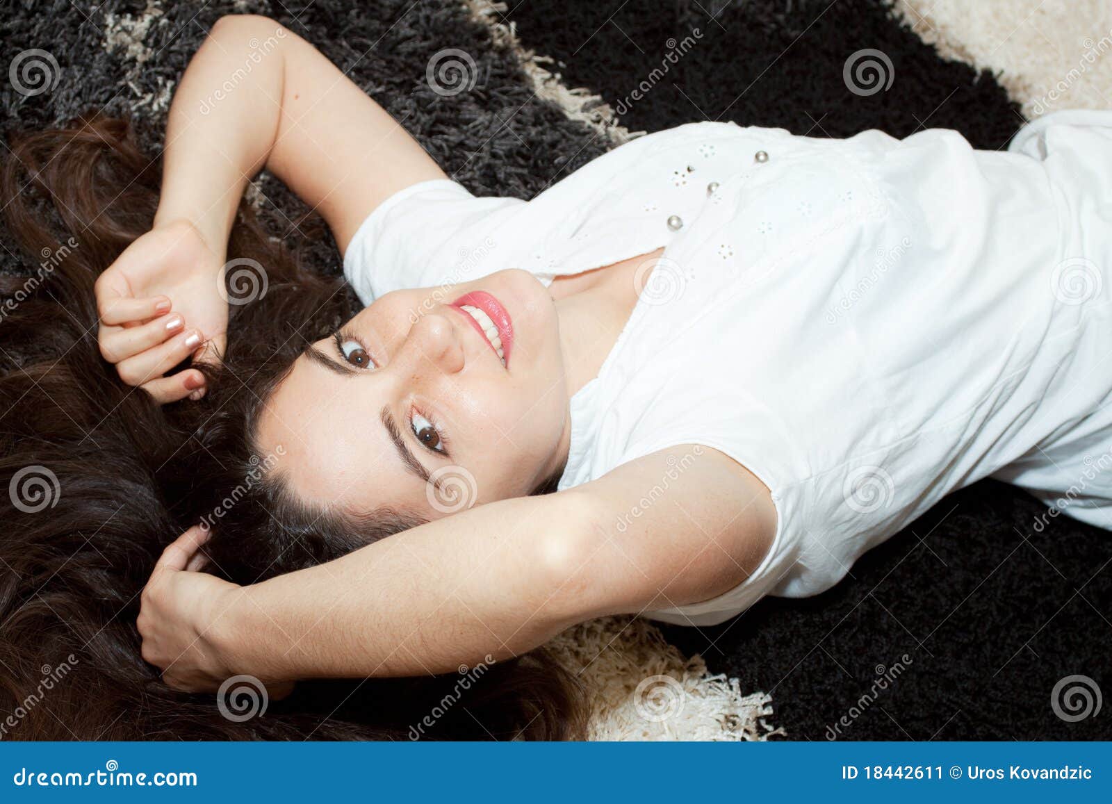 Young Woman Lying on a Carpet Stock Image - Image of adult, people ...