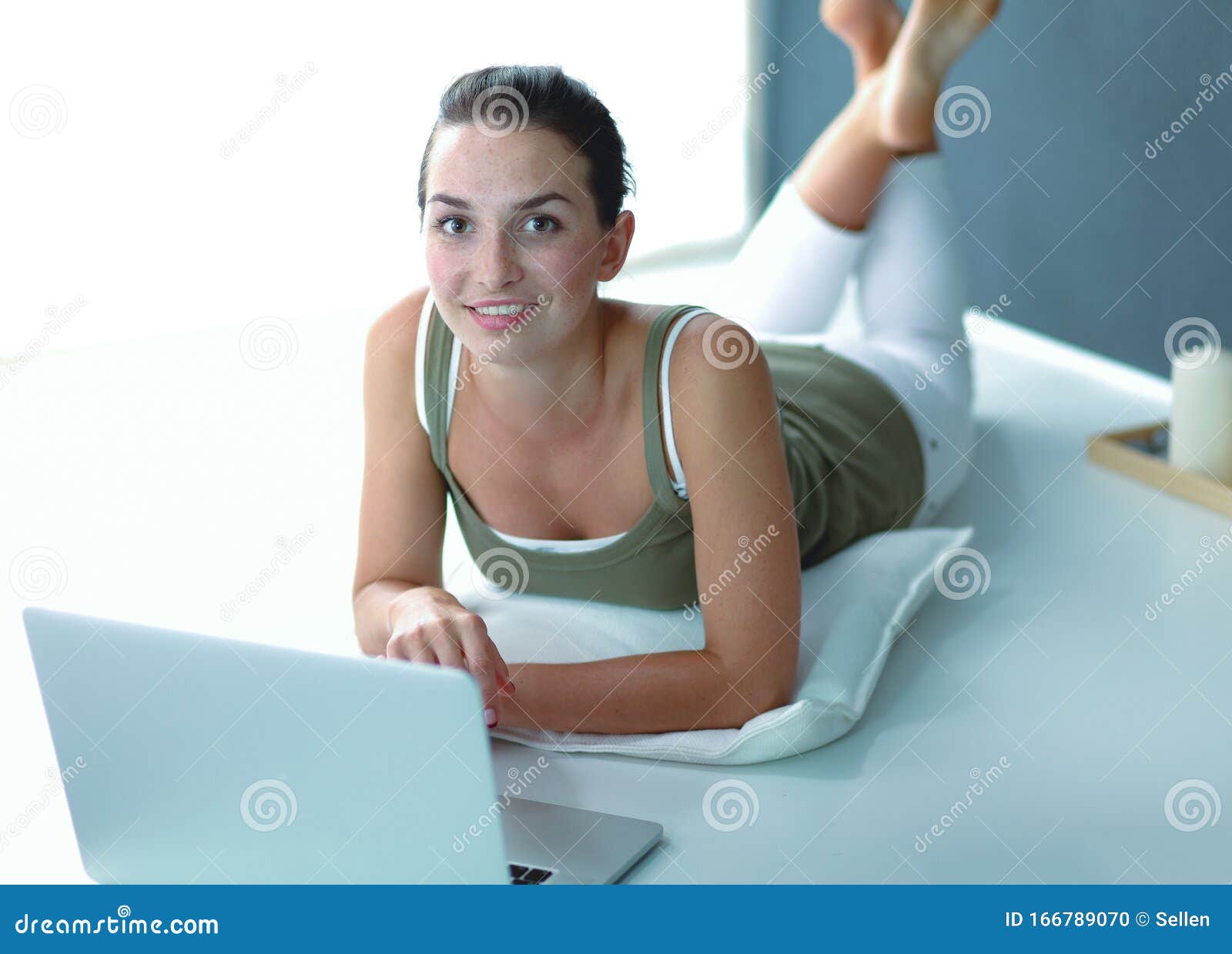 A Young Woman Lying on the Floor with a Laptop Stock Photo - Image of floor, caucasian: 166789070