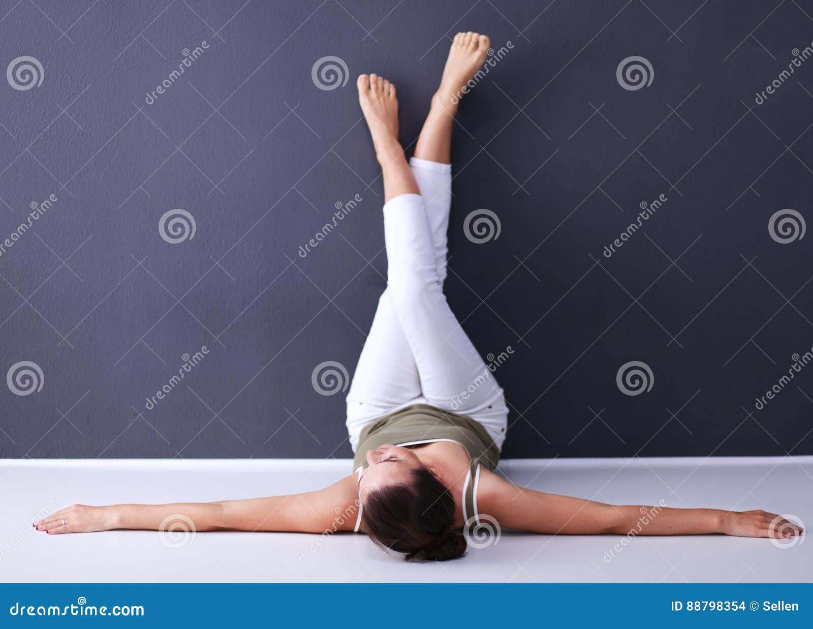 Young Woman Lying on the Floor with Legs Up Stock Photo - Image of lady ...