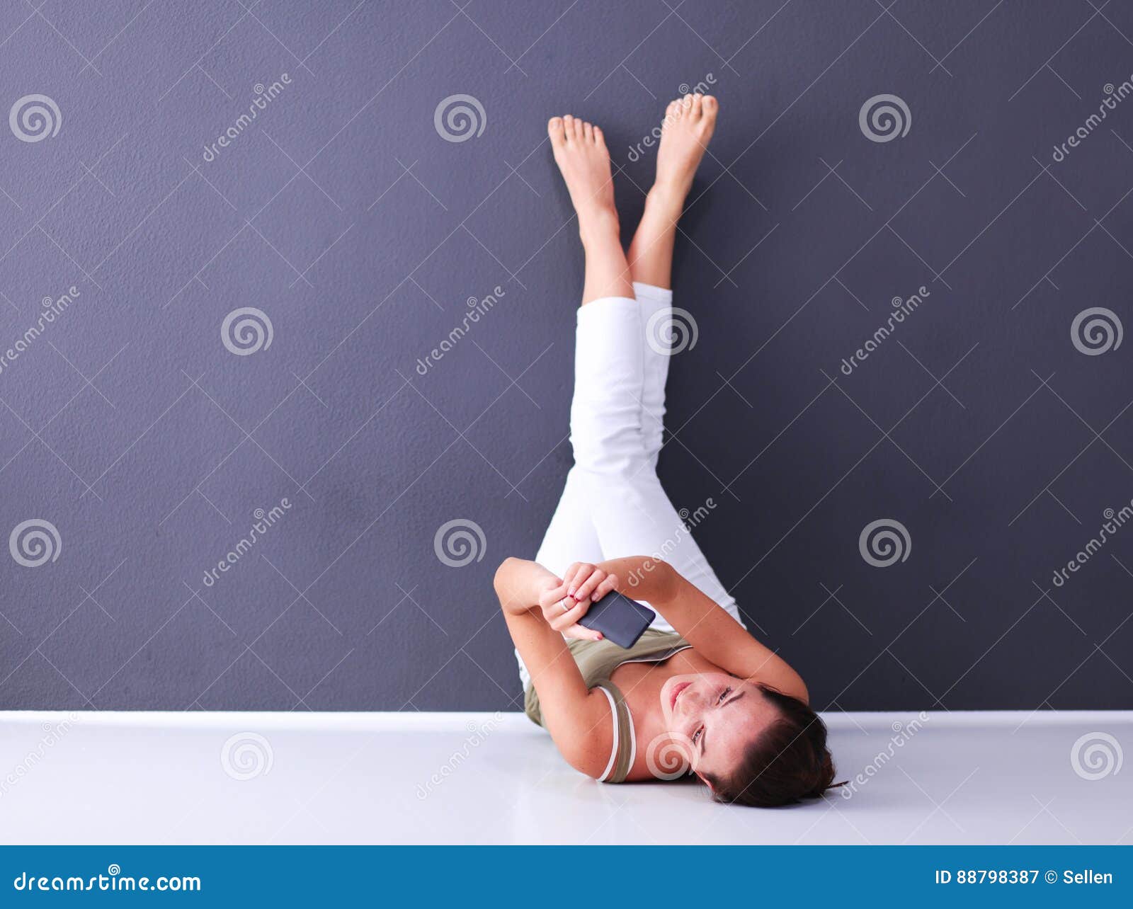 Young Woman Lying on the Floor with Legs Up Stock Image - Image of cute ...