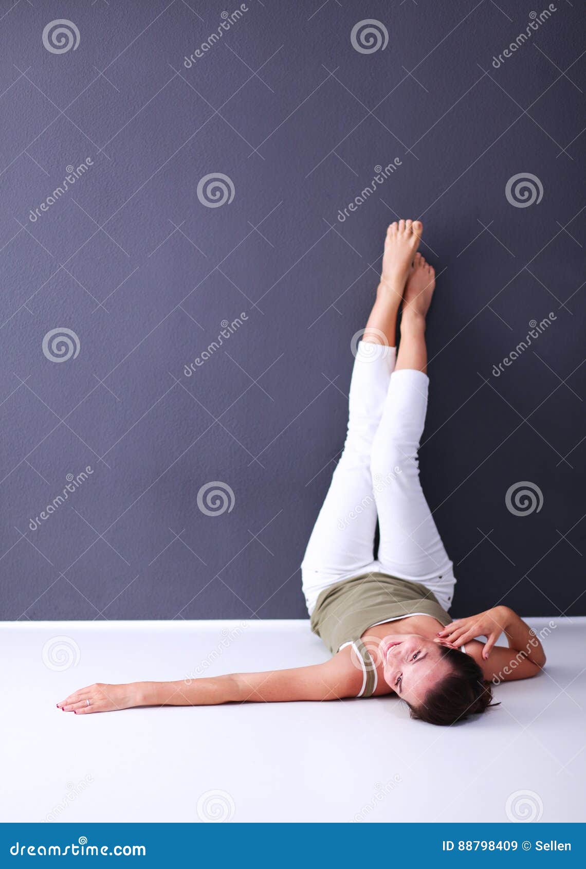 Young Woman Lying on the Floor with Legs Up Stock Image - Image of home ...