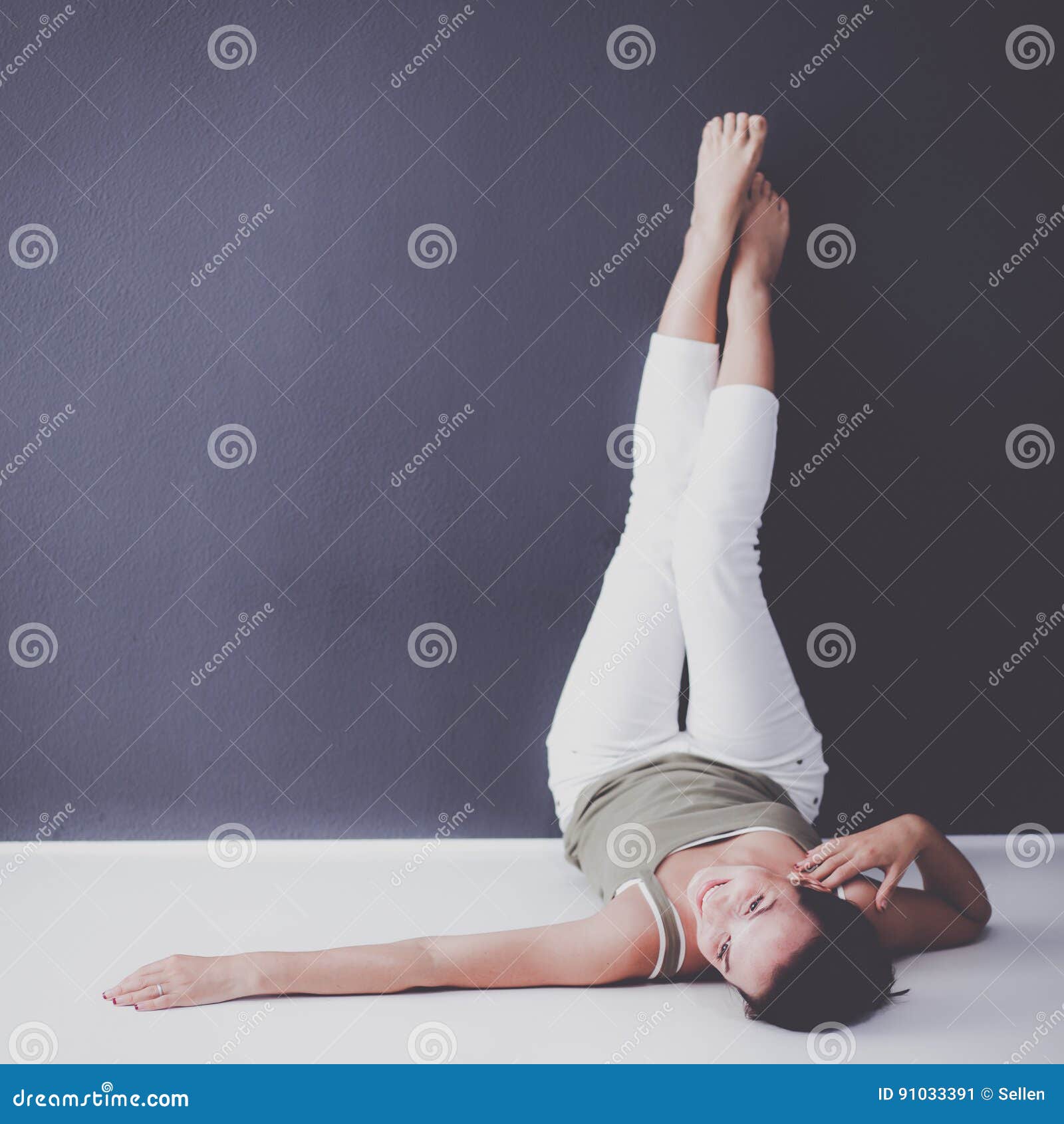 Young Woman Lying on the Floor with Legs Up Stock Image - Image of lady ...