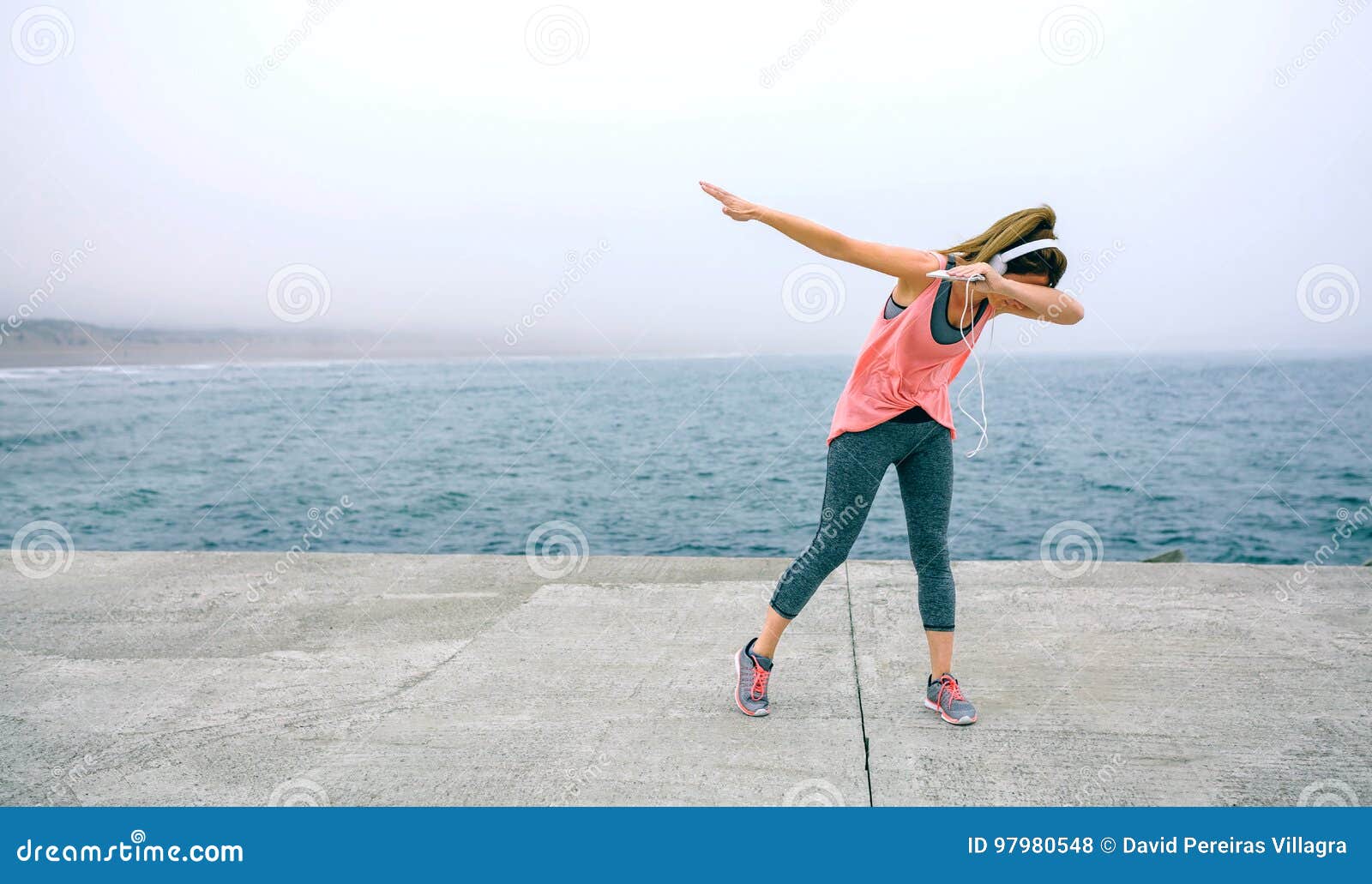 Young Woman Making Dab Dance Outdoors Stock Photo - Image of pier ...