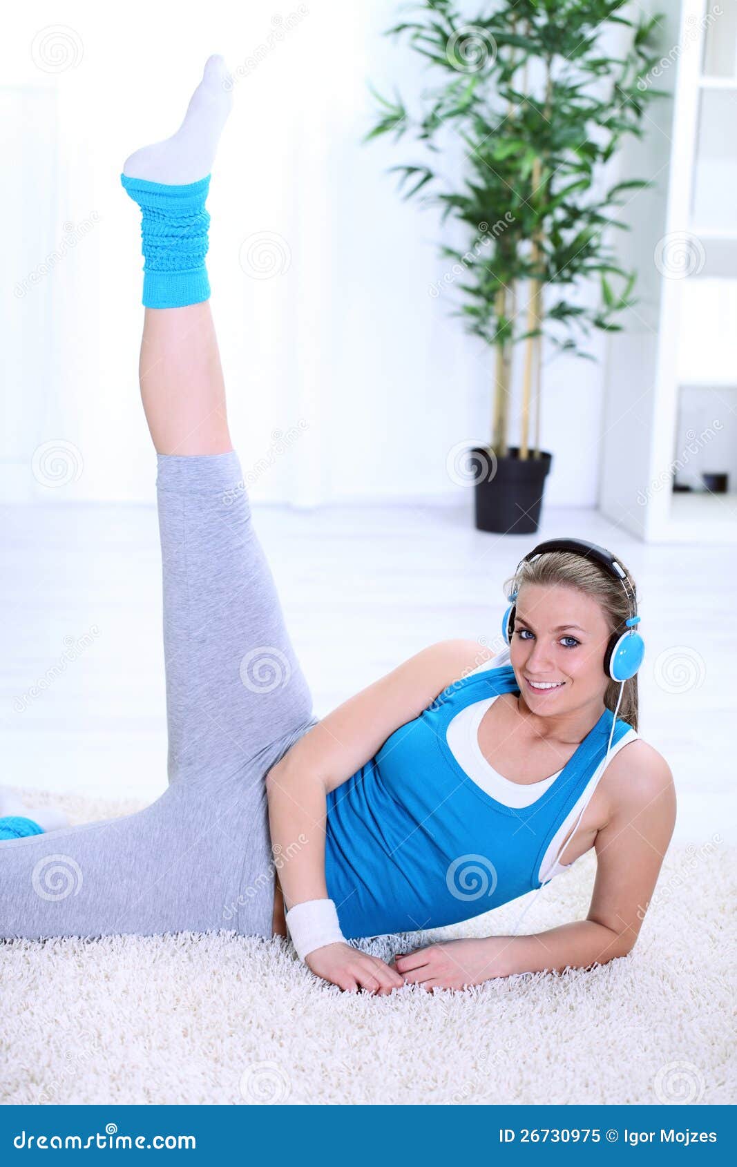 Young Woman Making Exercises at Home Stock Image - Image of blue ...