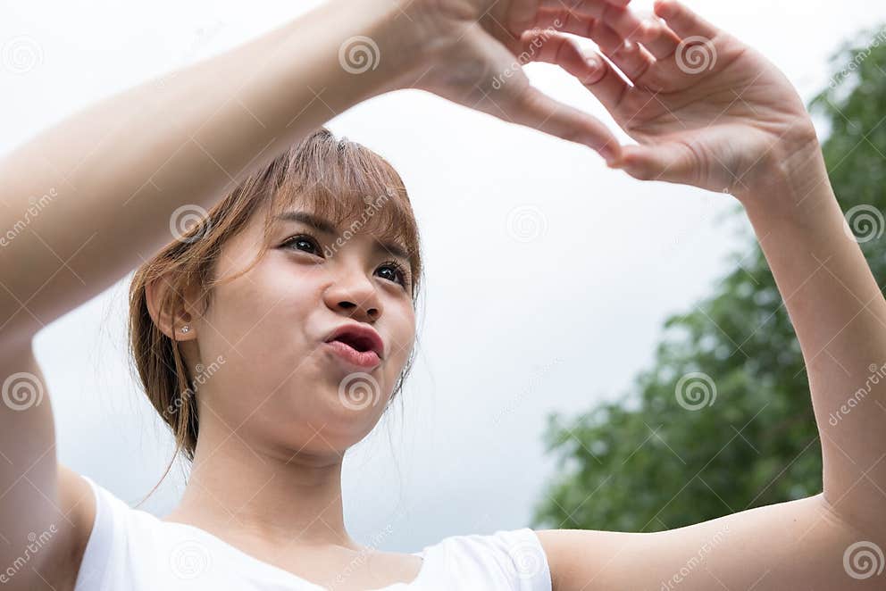 Young Woman Making A Heart Gesture With Her Fingers Asian Girl Stock