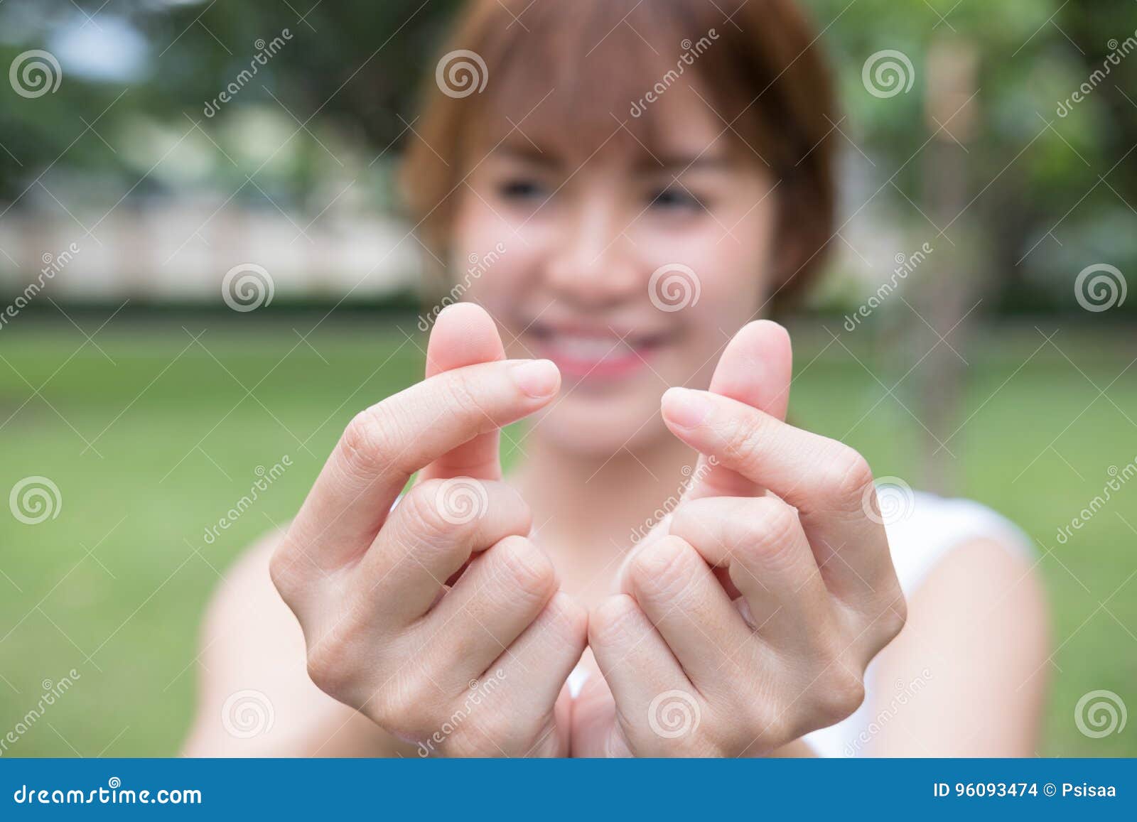 Young Woman Making A Heart Gesture With Her Fingers Asian Girl Stock