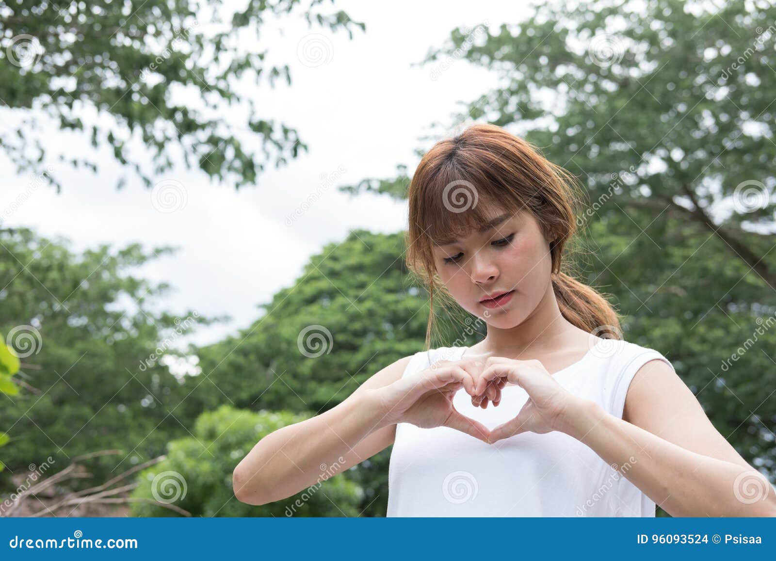Young Woman Making A Heart Gesture With Her Fingers Asian Girl Stock