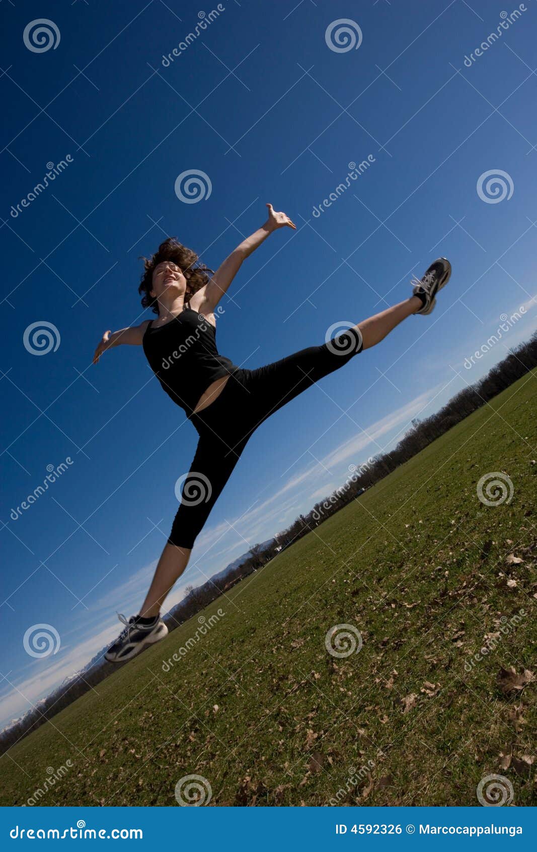 Young woman making a jump stock photo. Image of caucasian - 4592326