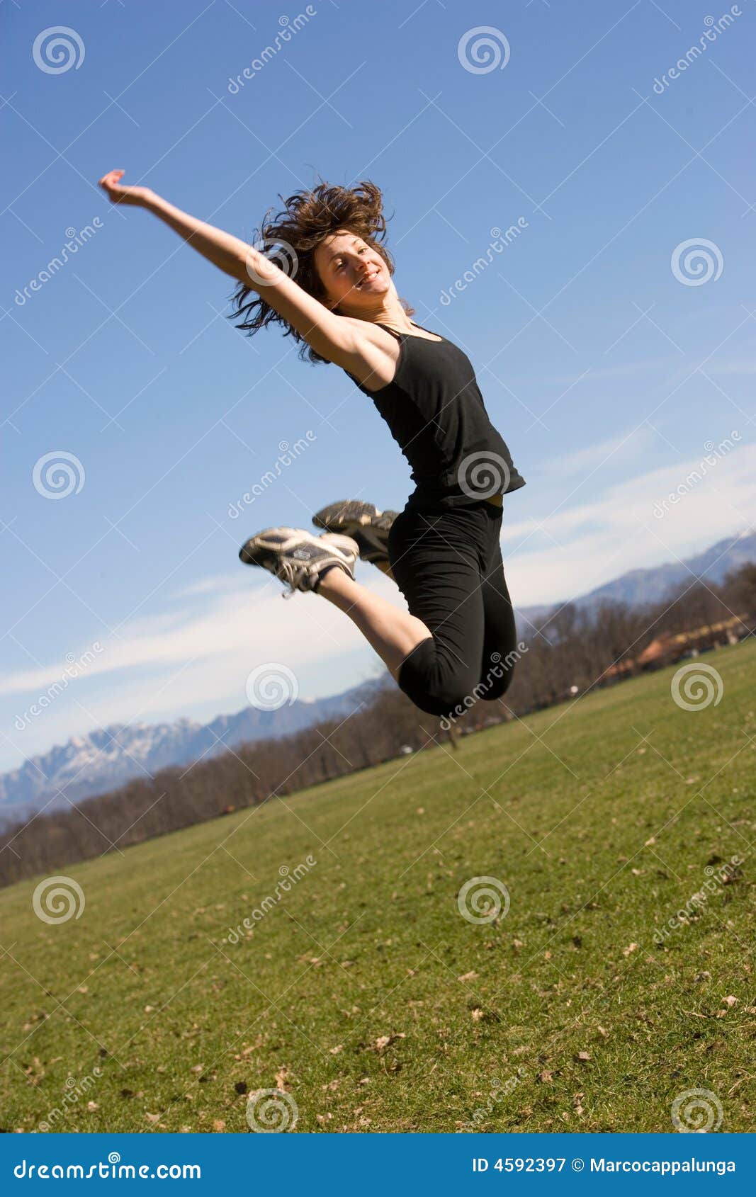 Young woman making a jump stock image. Image of emotion - 4592397