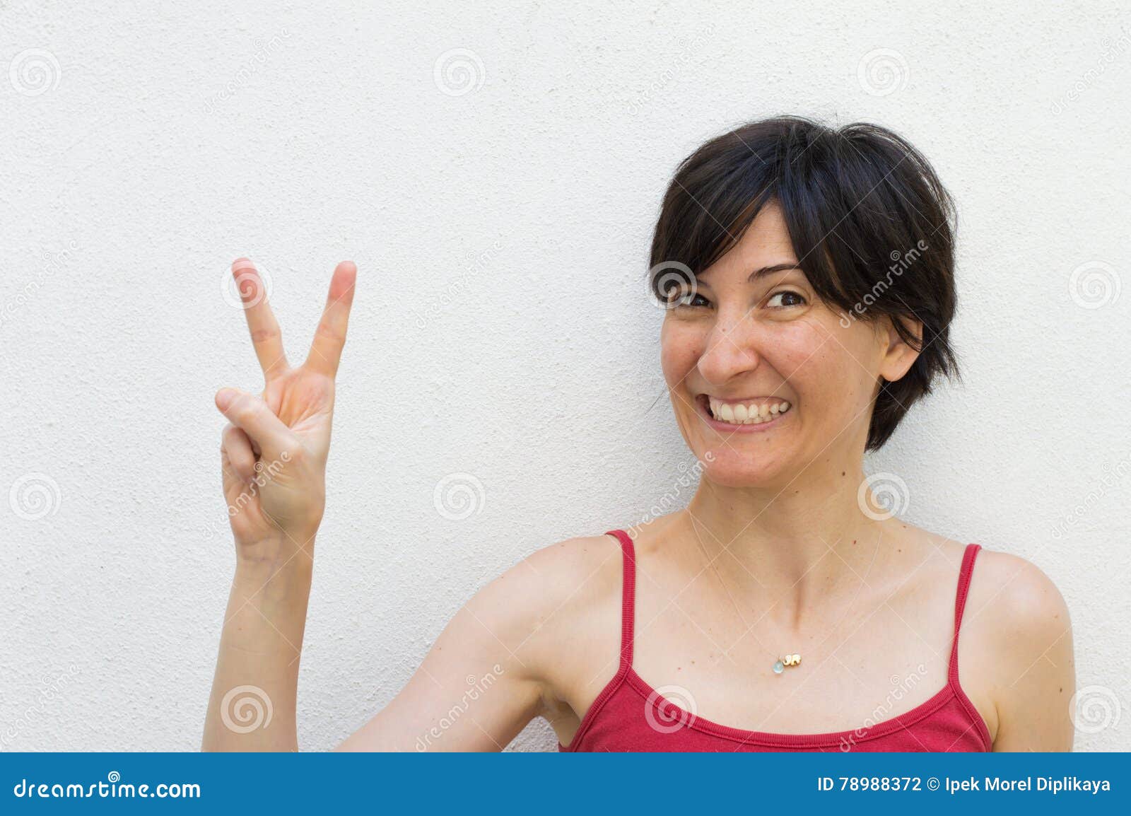 Young Woman Making a Peace Sign Stock Photo - Image of female, clean ...