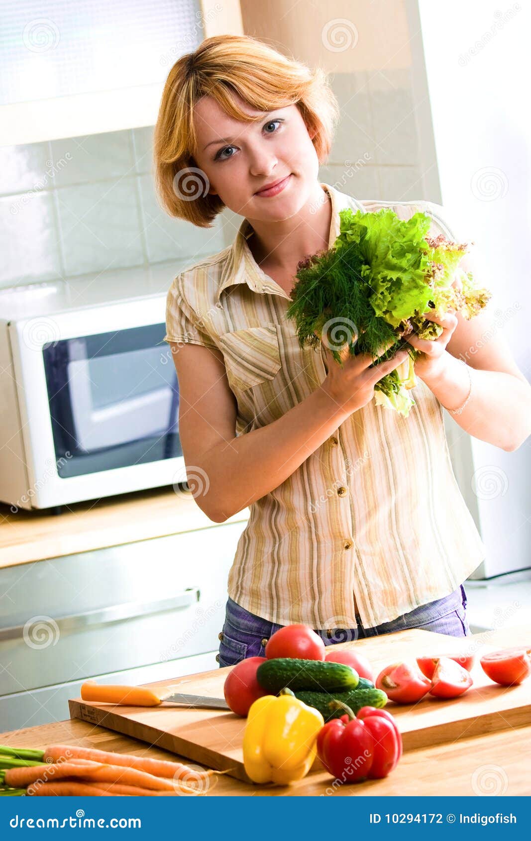 Young woman making salad stock photo. Image of knife - 10294172
