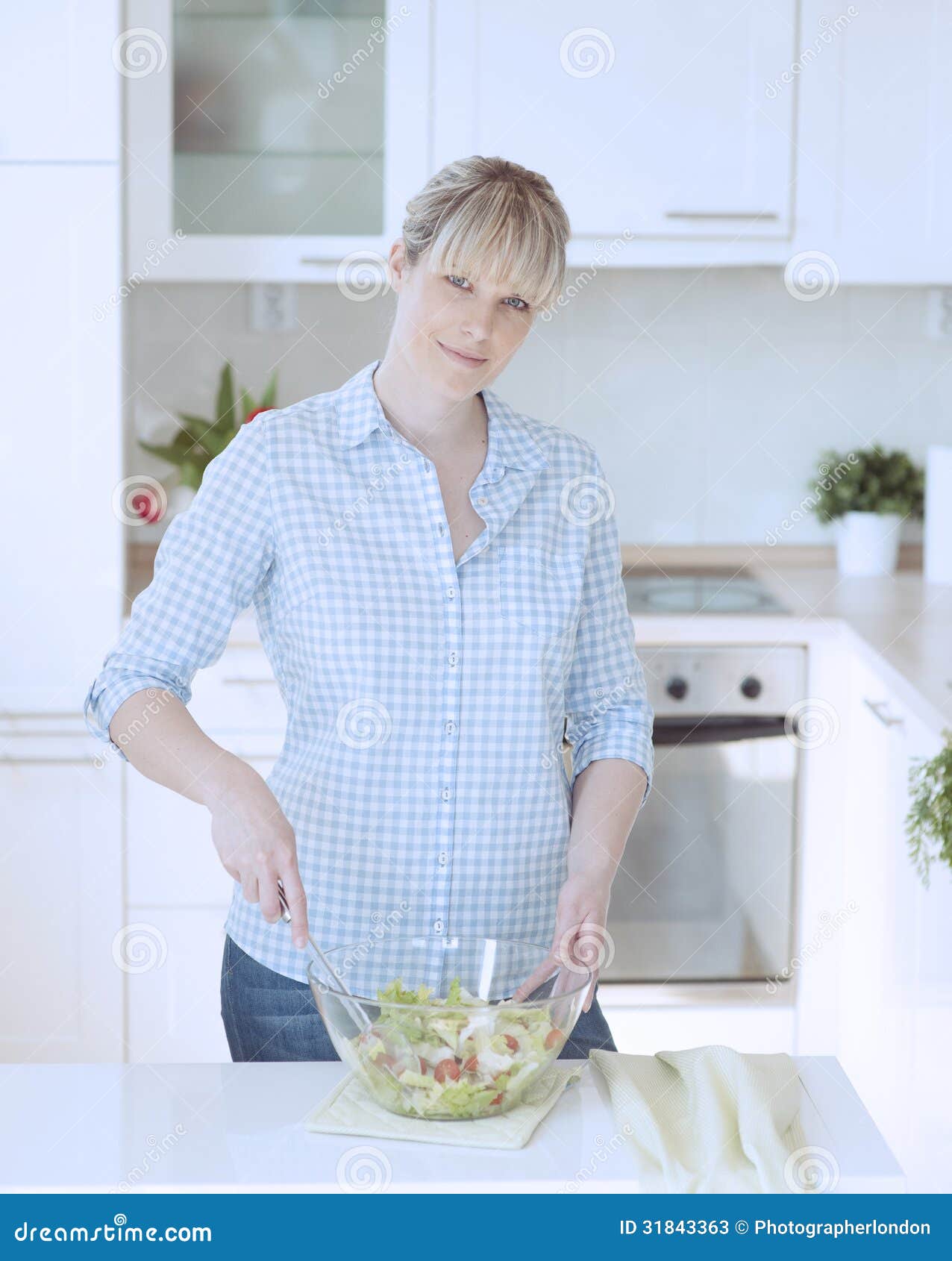 Young woman making salad stock image. Image of preparation - 31843363