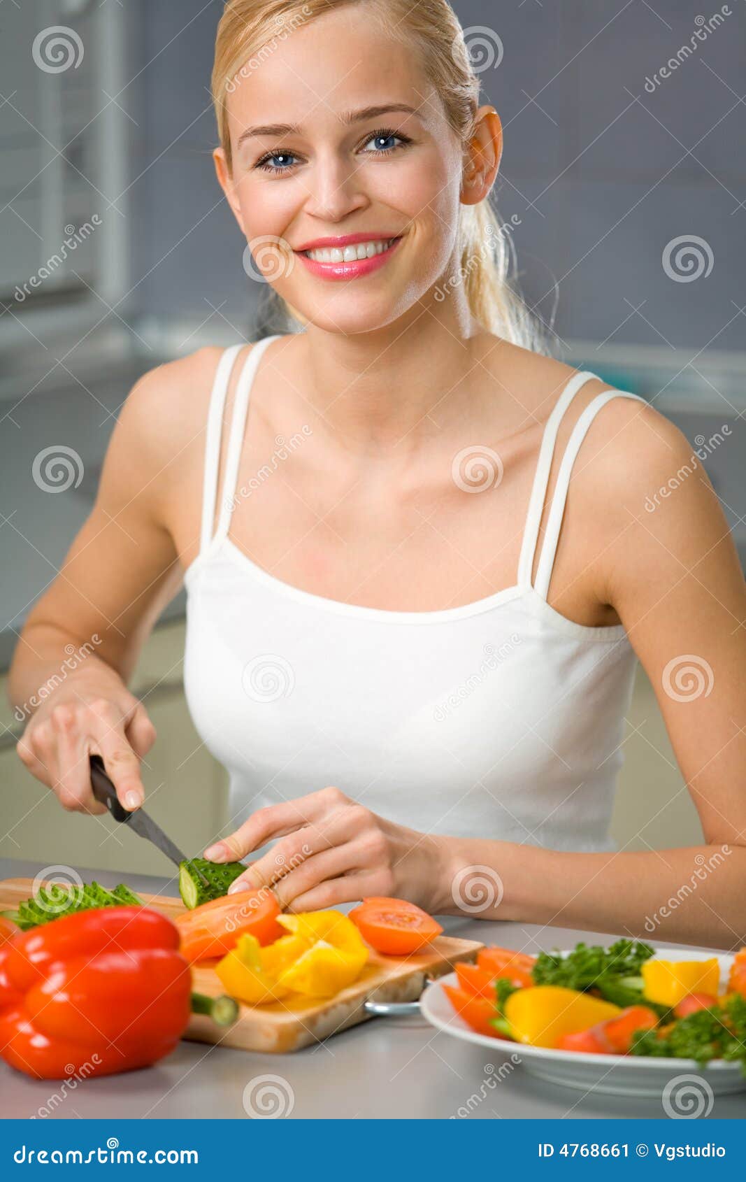 Young woman making salad stock image. Image of blond, lunch - 4768661