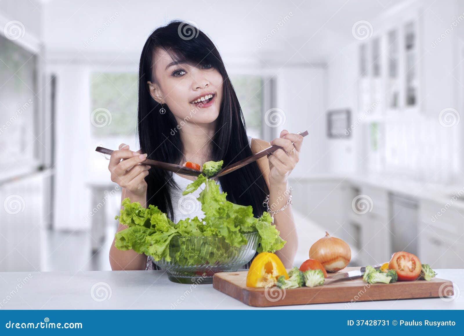 Young woman making salad stock image. Image of bowl, kitchen - 37428731