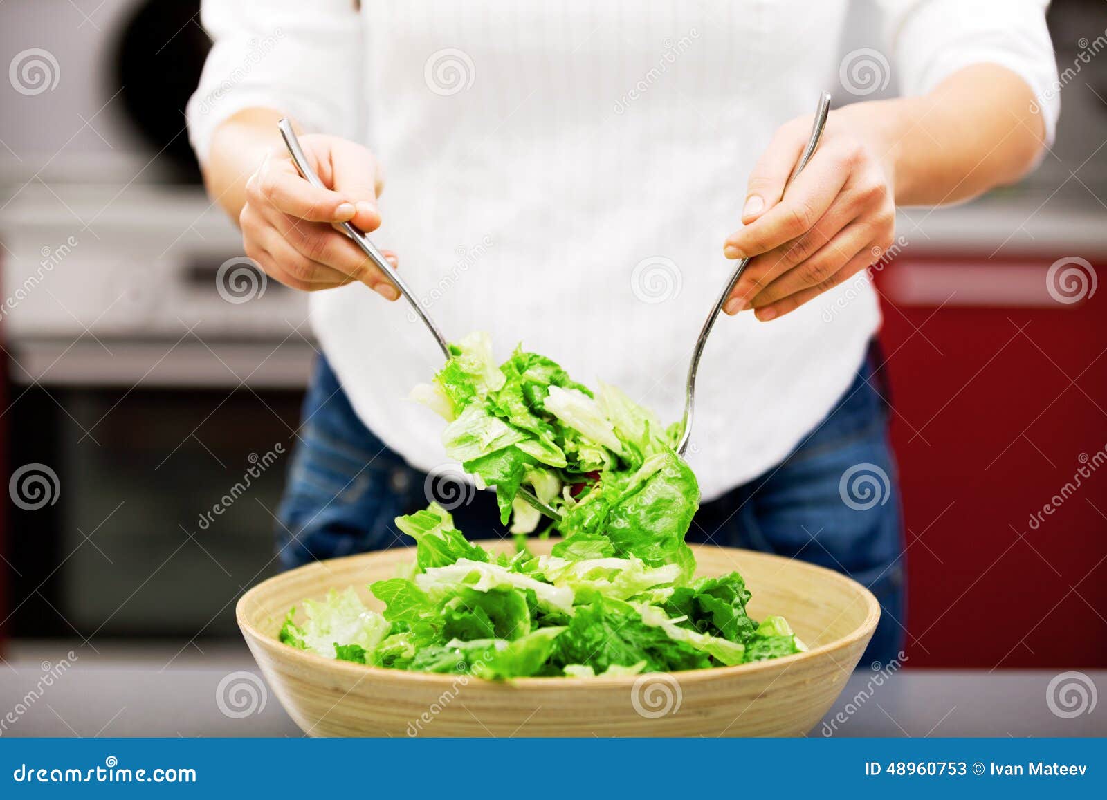 Young woman making salad stock image. Image of closeup - 48960753