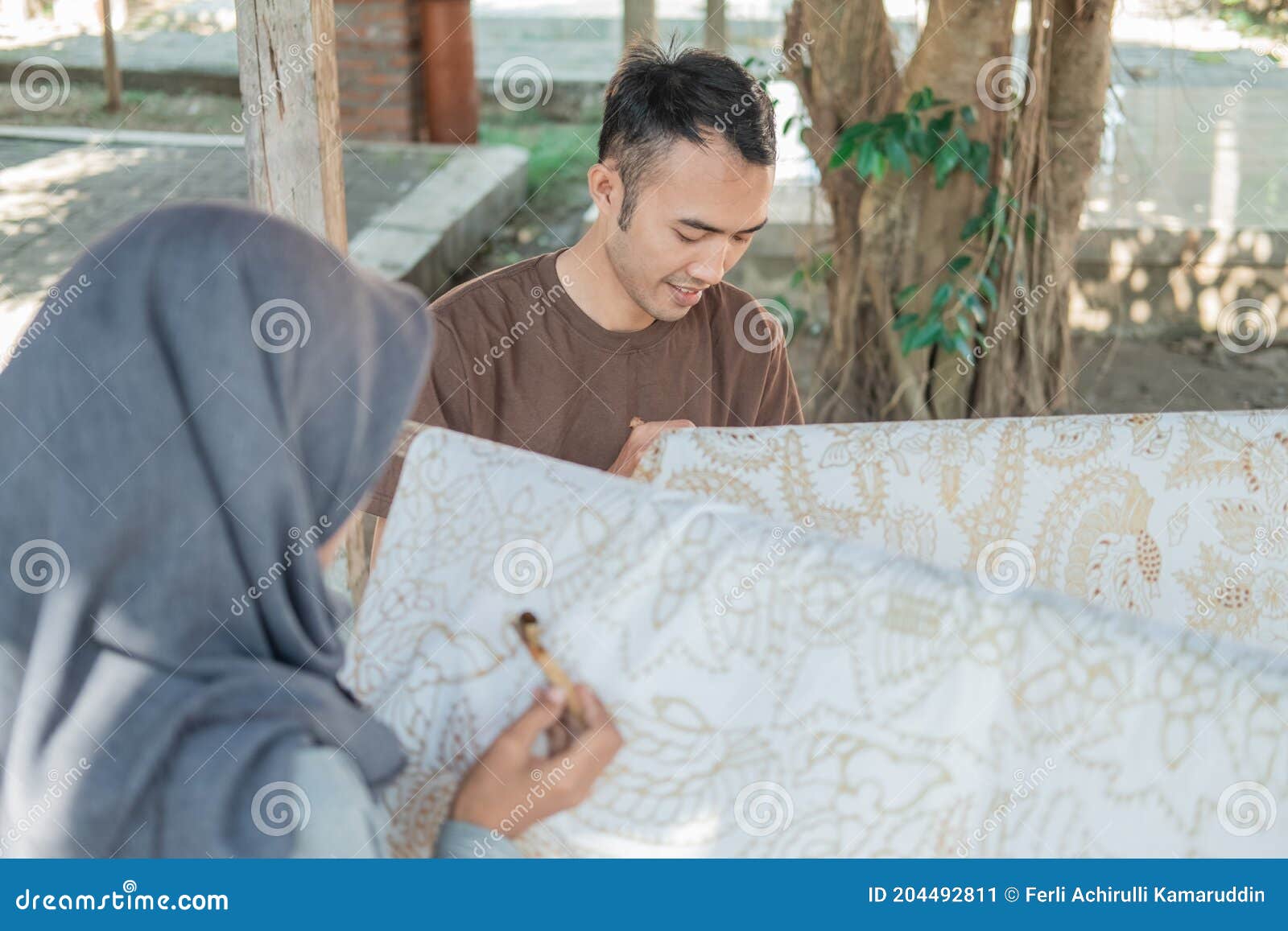 Young Woman and Man Drawing Batik Stock Image - Image of background ...
