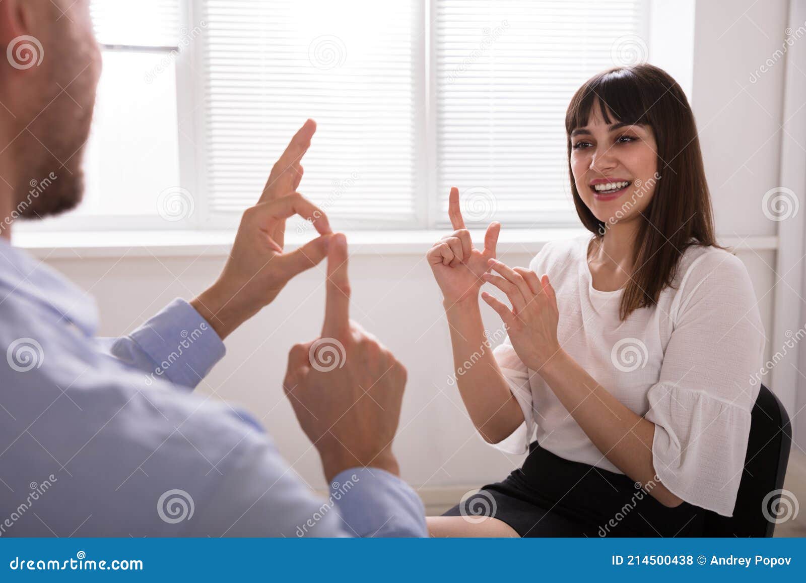 Young Woman and Man Talking with Sign Language Stock Photo - Image of ...