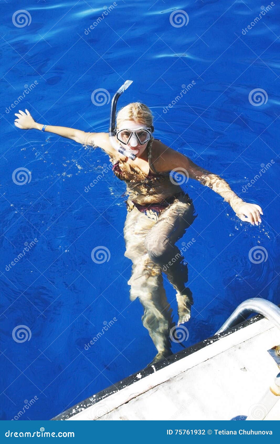 Young Woman in a Mask Floats in the Sea Stock Photo - Image of beauty ...