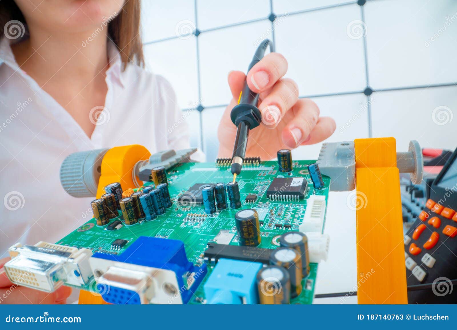 Young Woman with Measuring Devices in the Electronics Engineer ...