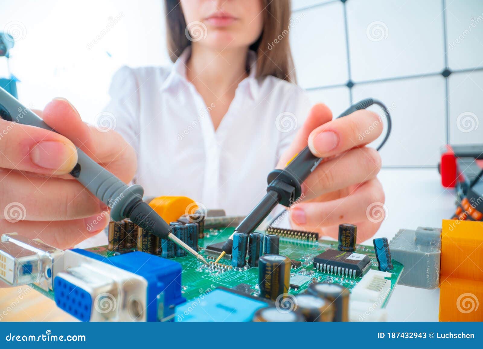 Young Woman with Measuring Devices in the Electronics Engineer ...