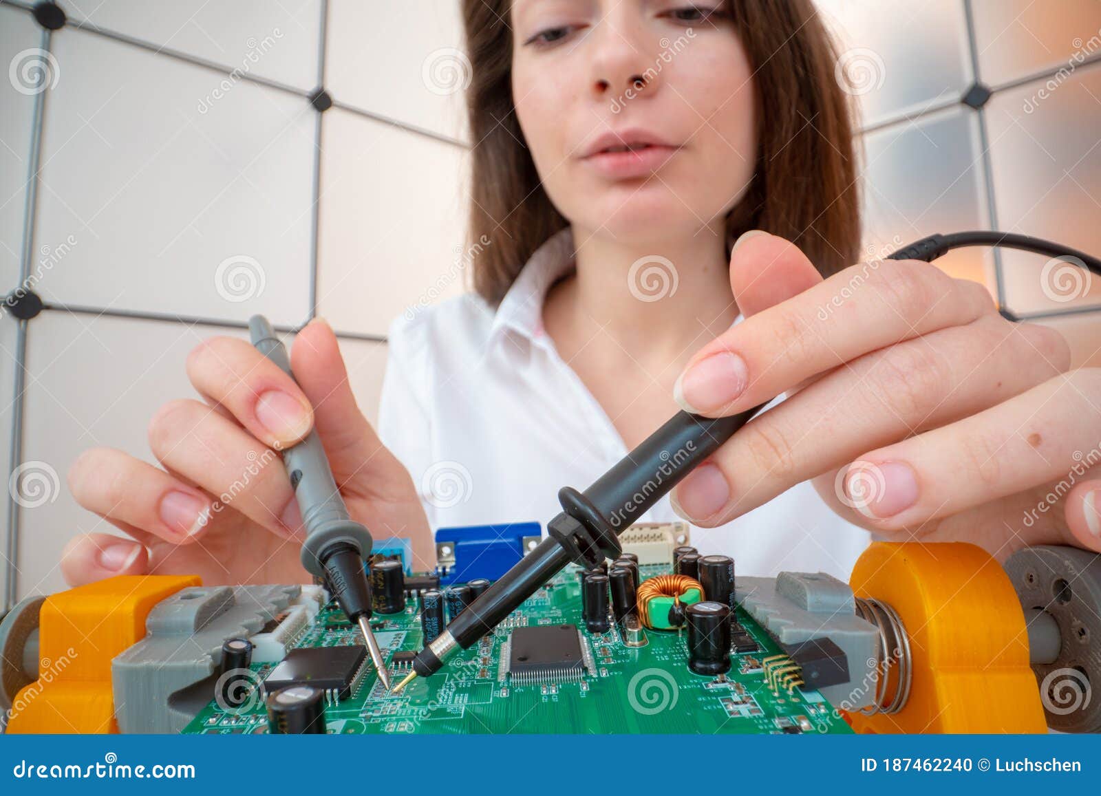 Young Woman with Measuring Devices in the Electronics Engineer ...