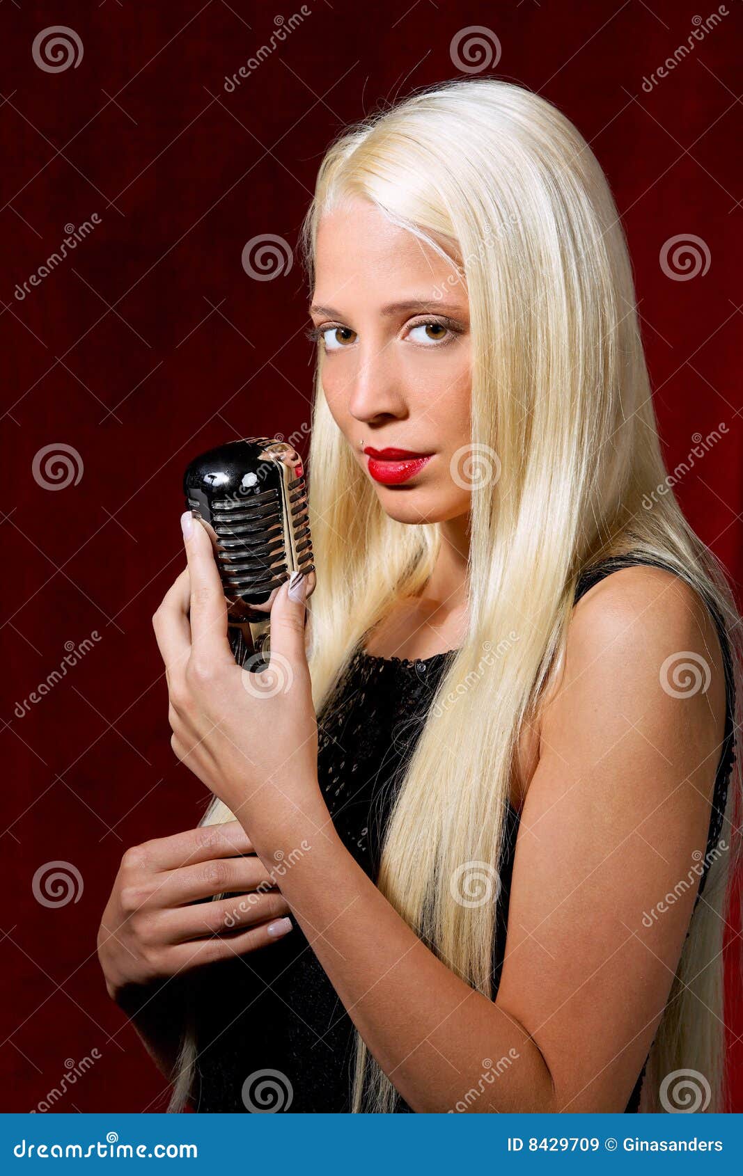Young Woman with a Microphone As a Singer Stock Image - Image of hair ...