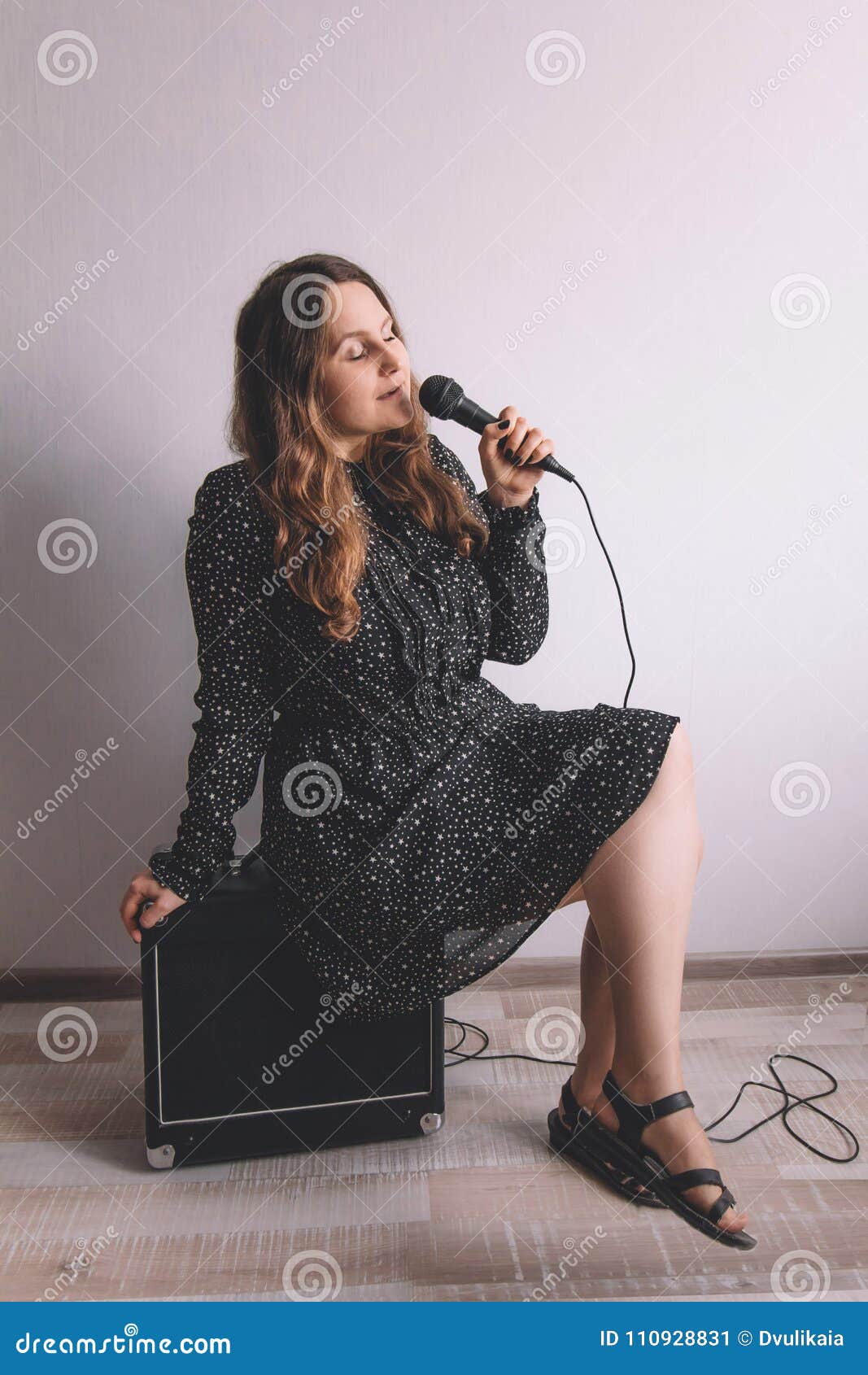 Young Woman with a Microphone in Hands Stock Image - Image of song ...