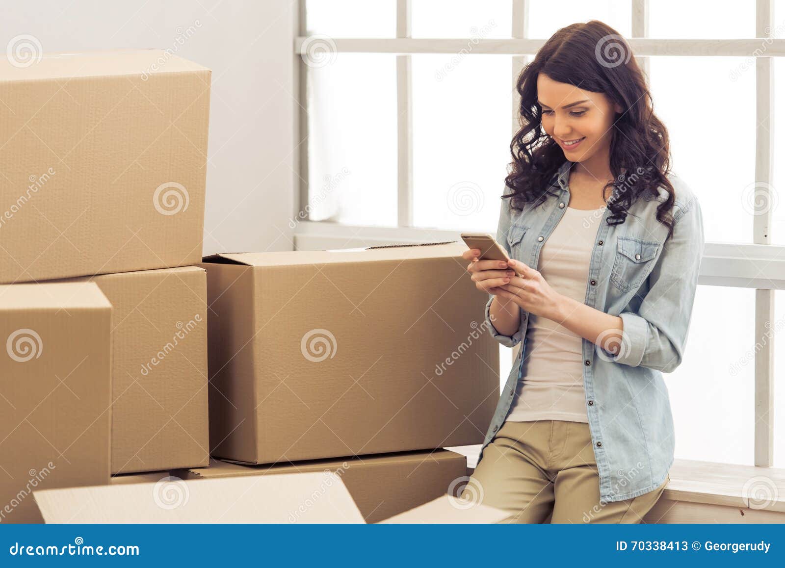 Young woman moving stock image. Image of message, mobile - 70338413