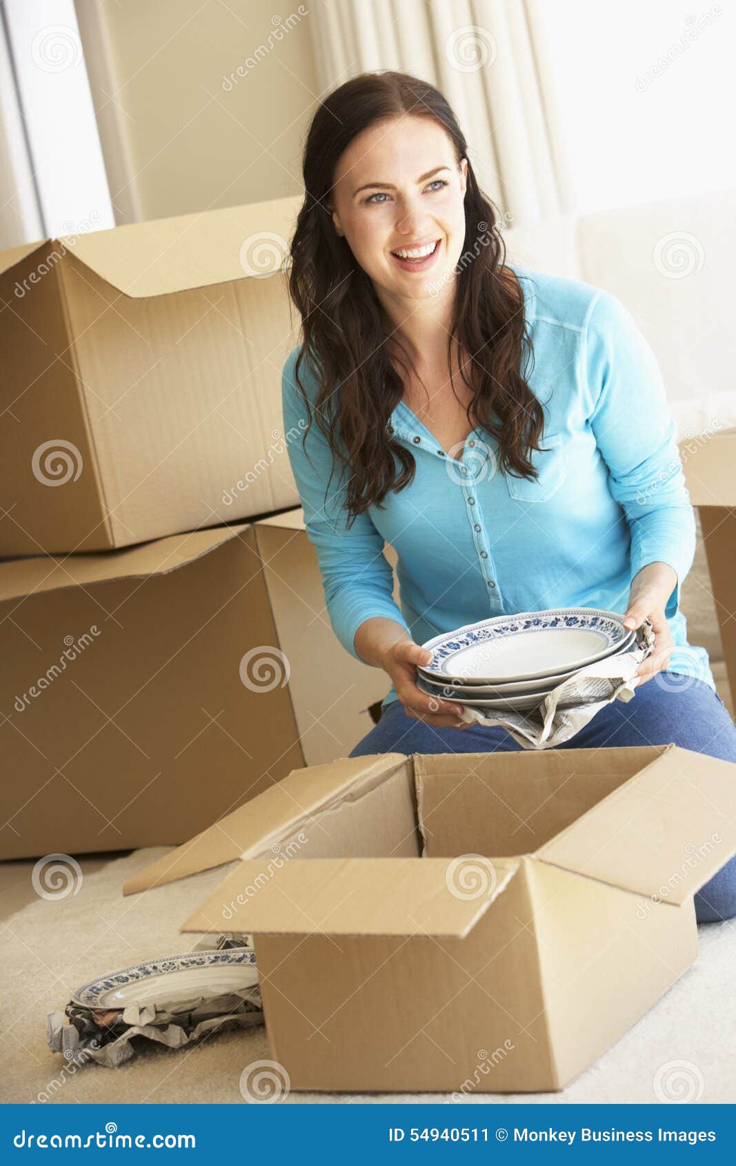 Young Woman Moving into New Home Unpacking Boxes Stock Image - Image of ...