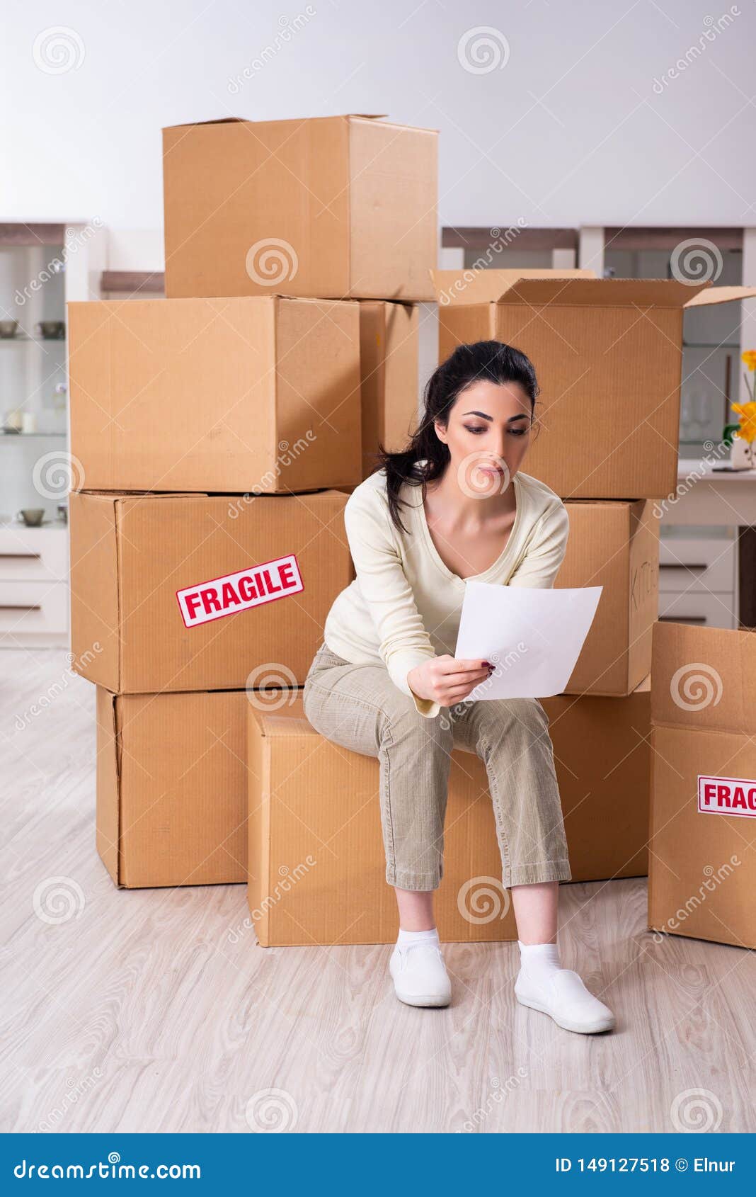 The Young Woman Moving To New Flat Stock Photo - Image of flat, moving ...