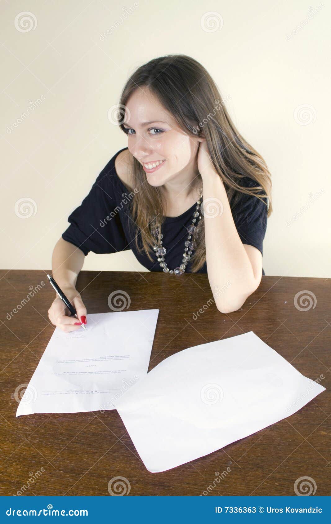 Young Woman in the Office Working with a Smile Stock Image - Image of ...
