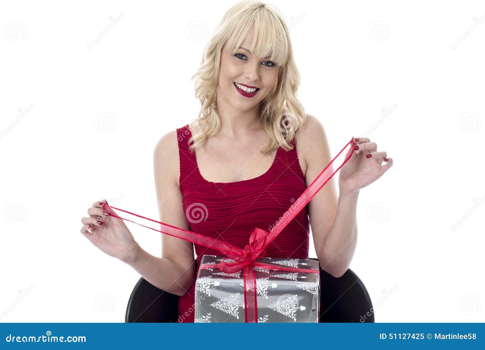 Young Woman Opening a Christmas Present Stock Image - Image of smiling ...