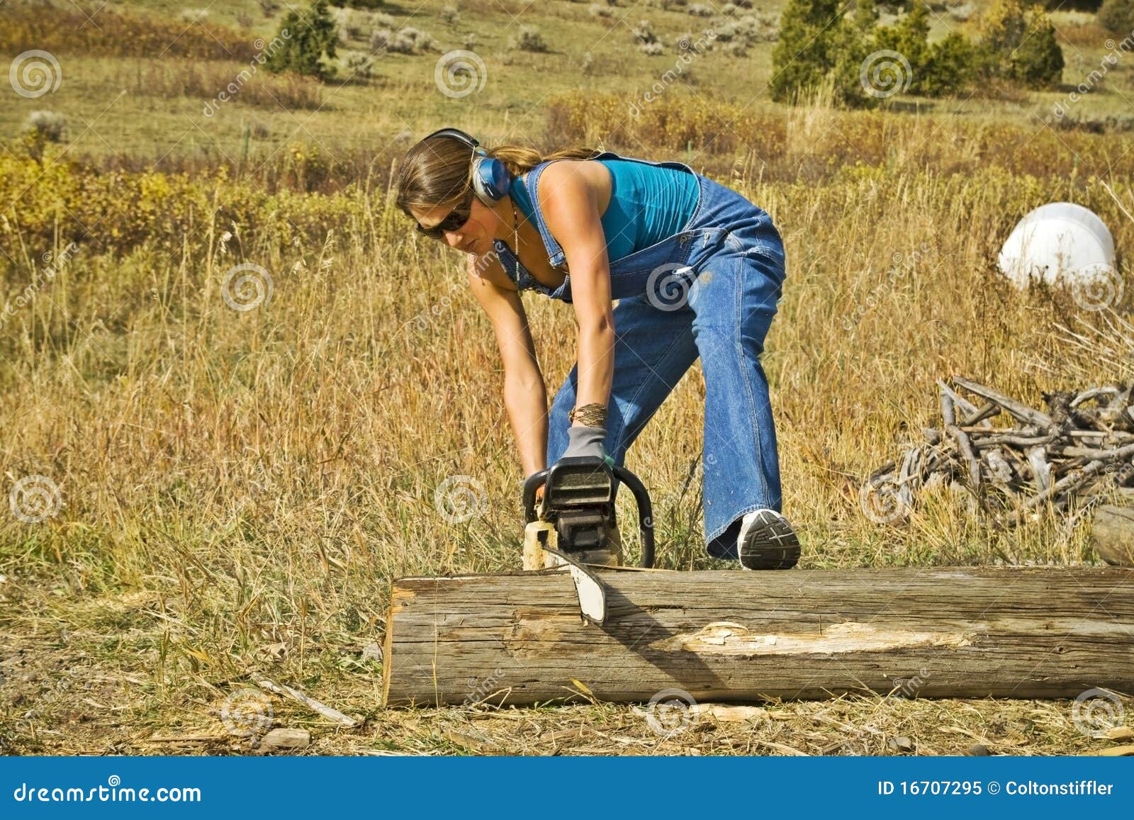 Young Woman Operating a Chainsaw Stock Image - Image of work, firewood ...