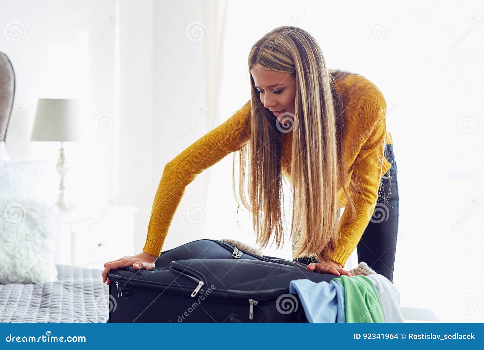 Young Woman Packing Suitcase Stock Photo - Image of pack, packed: 92341964
