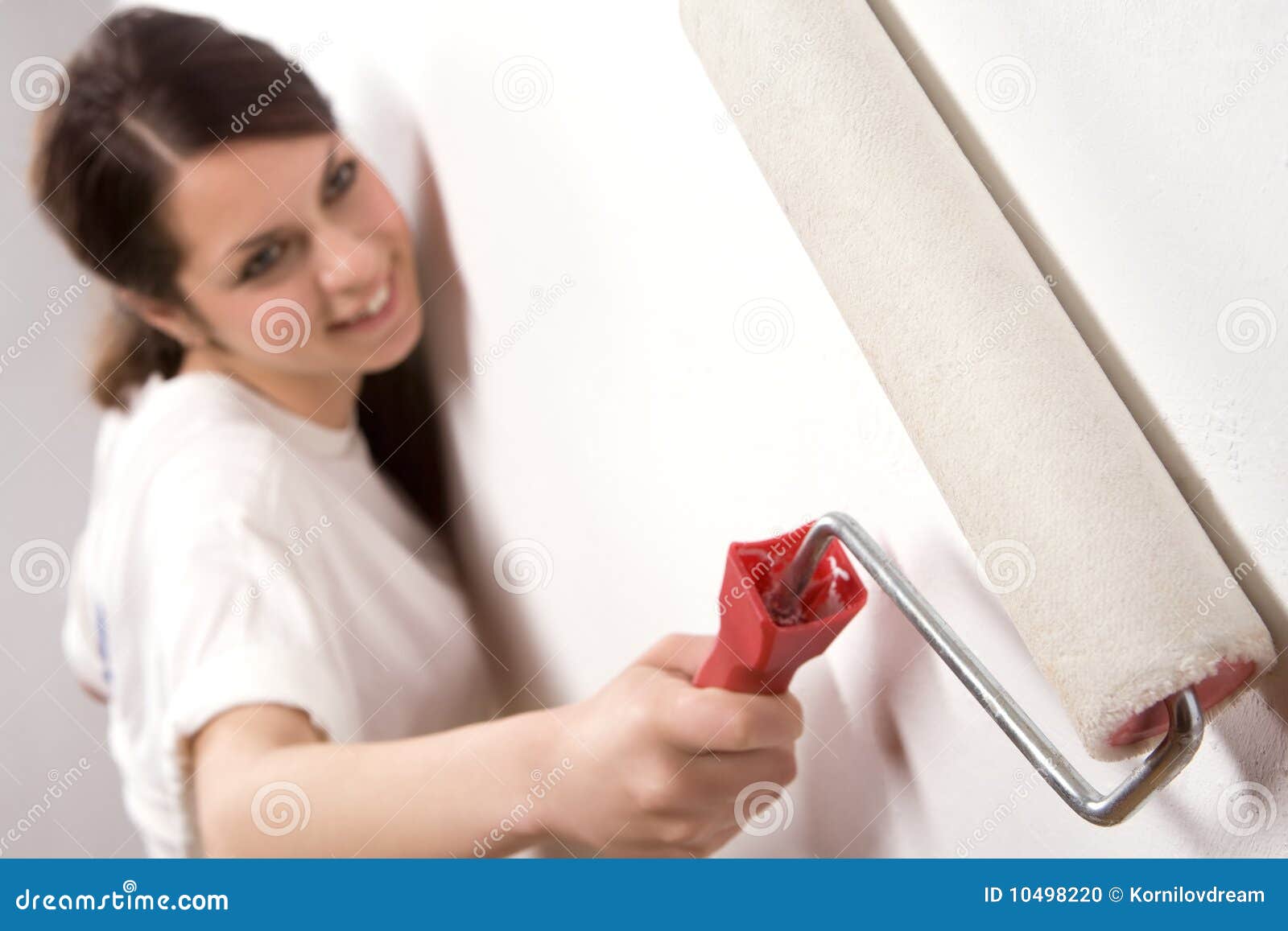 Young Woman with Painting Roller Stock Photo - Image of building, decor ...