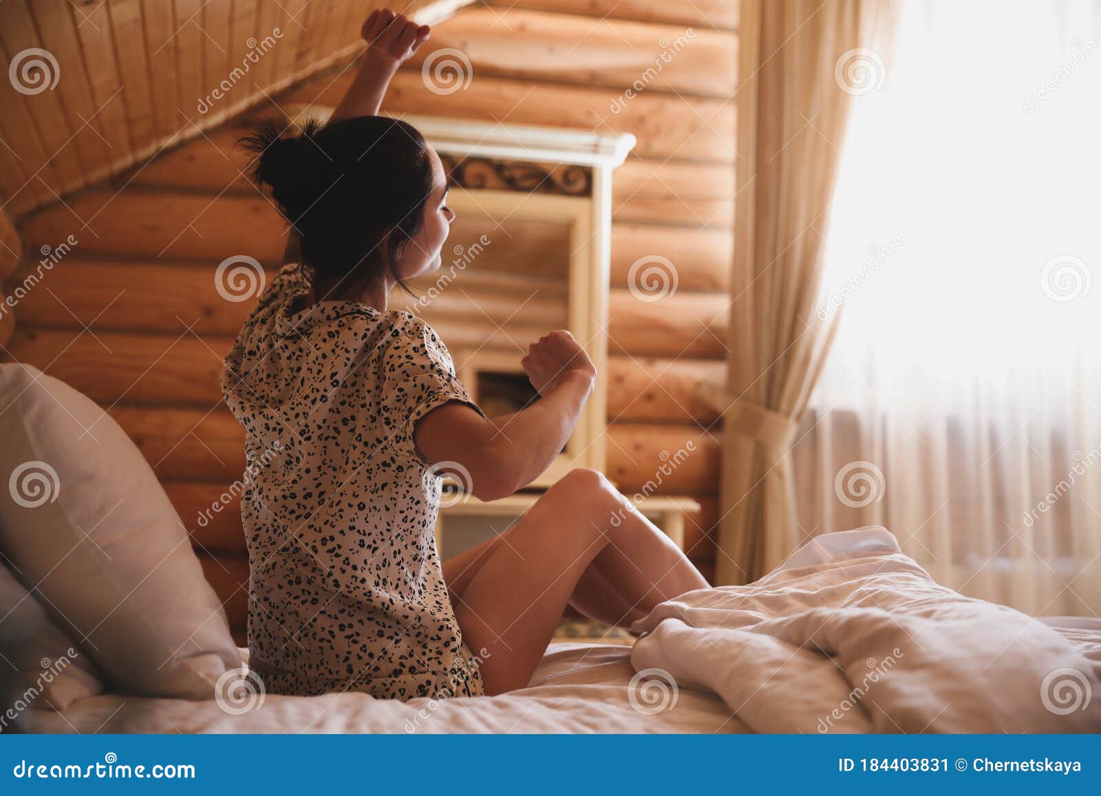 Young Woman In Pajamas Stretching On Bed Lazy Morning Stock Image