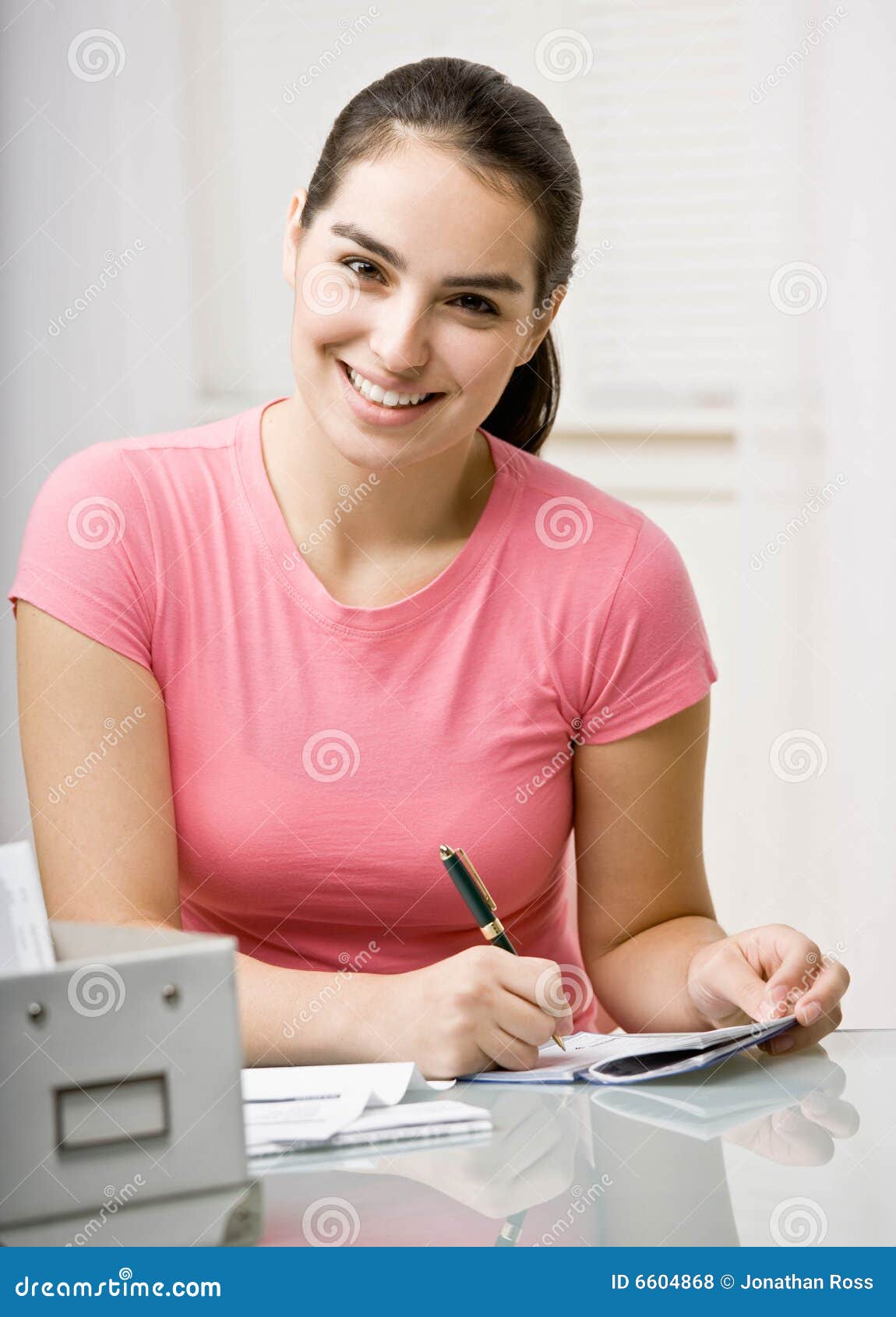 Young woman paying bills stock photo. Image of young, portrait - 6604868