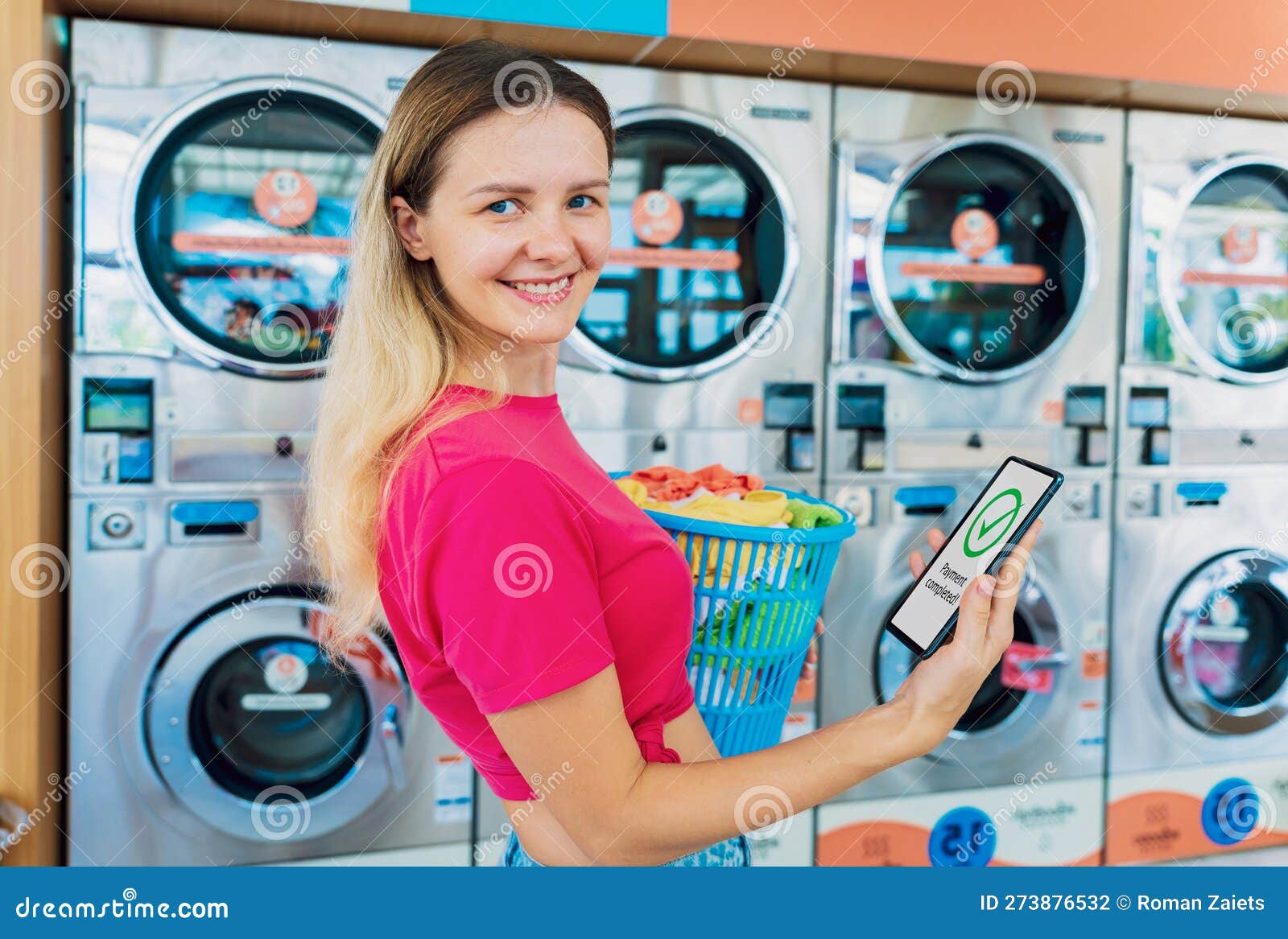 Young Woman Pays for Laundry Service Using Phone and Banking ...