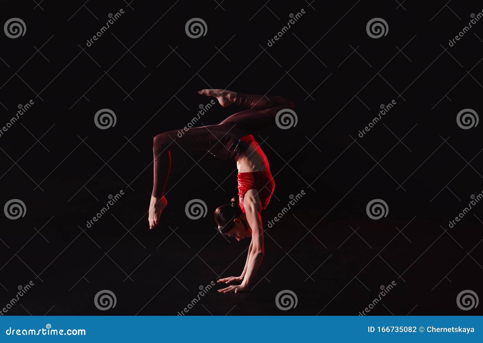 Young Woman Performing Acrobatic Element on Stage Stock Photo - Image ...