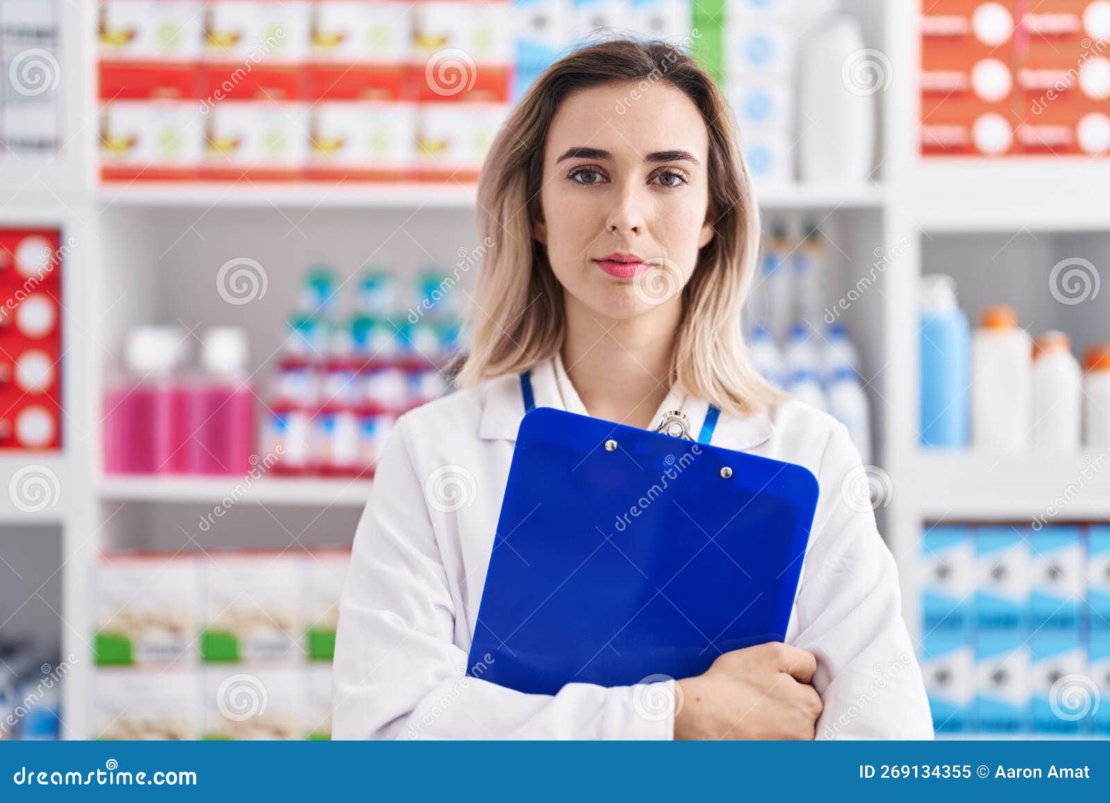 Young Woman Pharmacist Holding Checklist at Pharmacy Stock Image ...