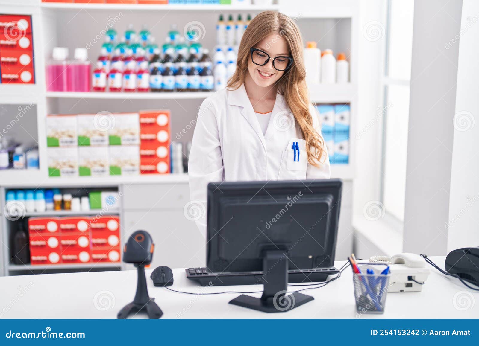Young Woman Pharmacist Smiling Confident Using Computer at Pharmacy ...