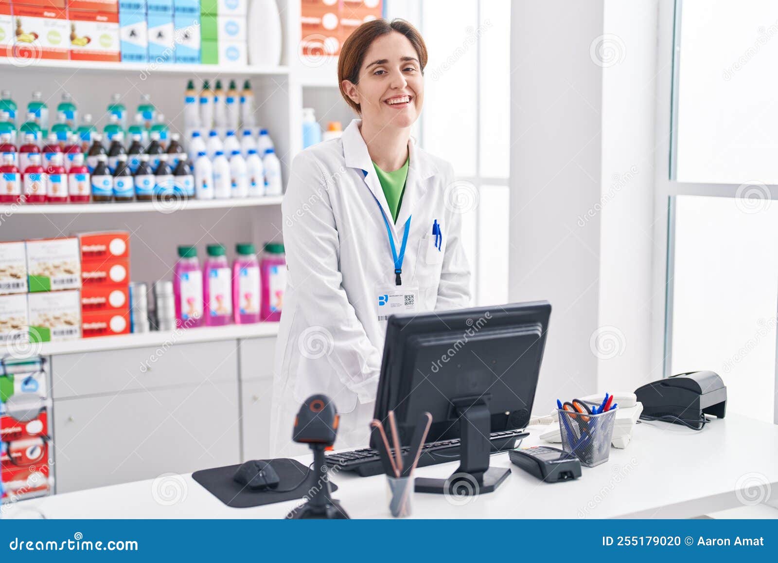 Young Woman Pharmacist Smiling Confident Using Computer at Pharmacy ...